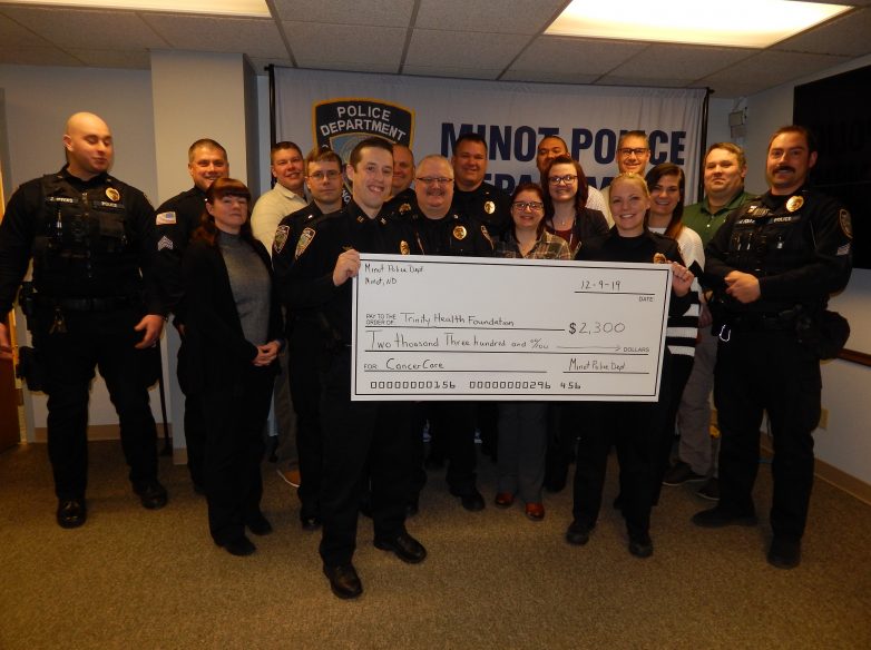 Minot Police Raise $2,300 for Cancer Patients - Trinity Health
